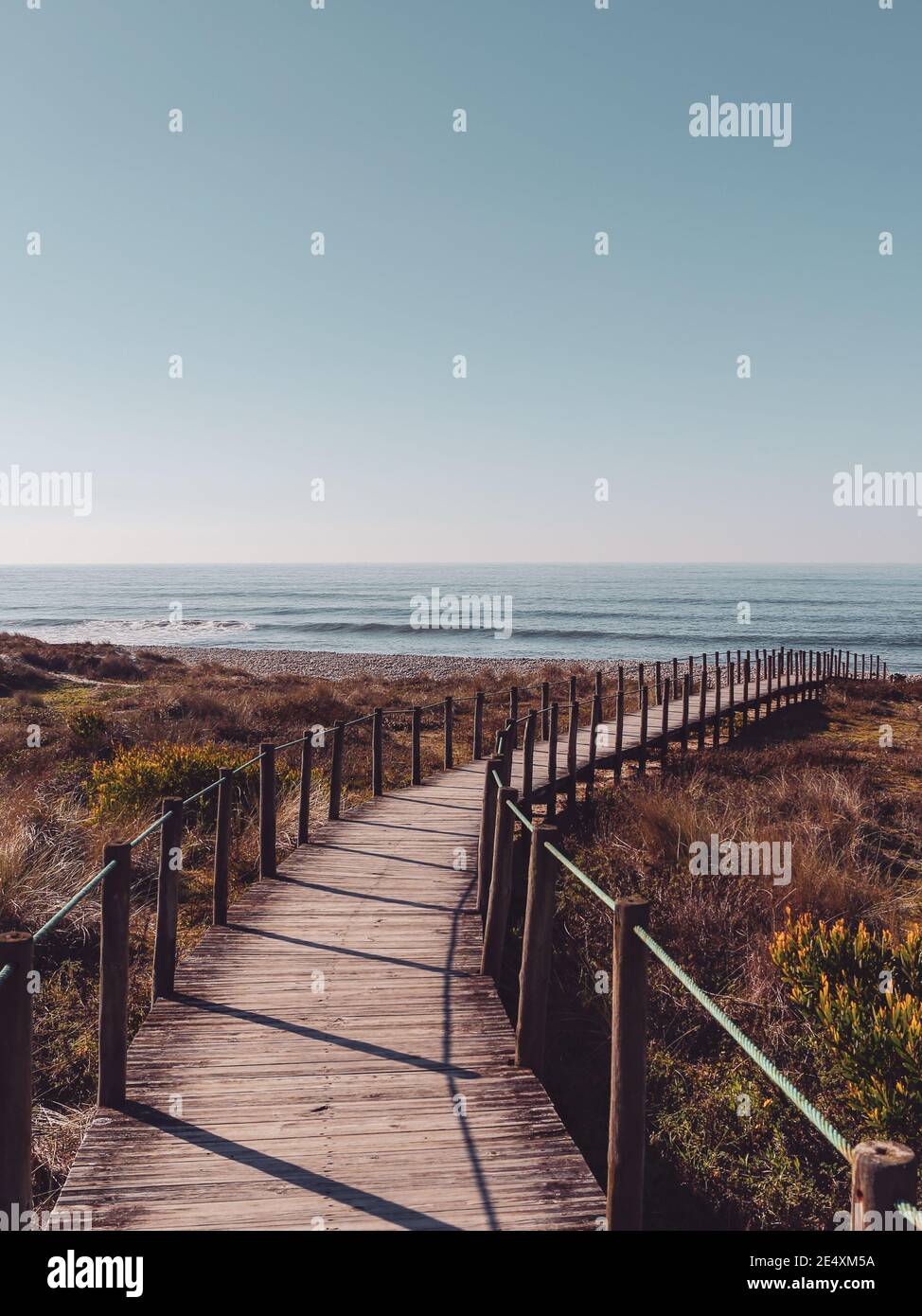 Wooden path over sand dunes with sea Stock Photo - Alamy