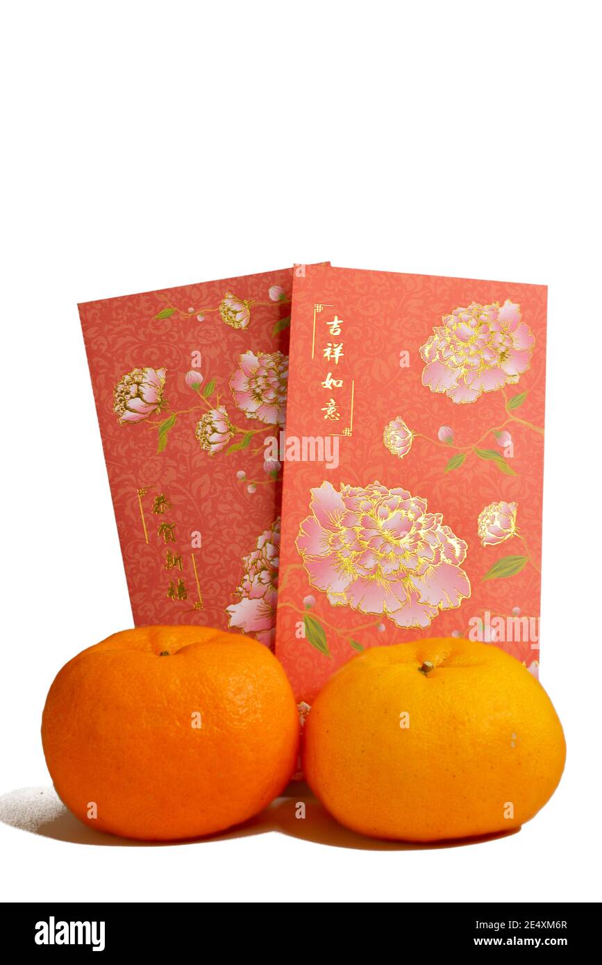 Mandarin Oranges (Lukan) and red envelope packets, isolated on white ...