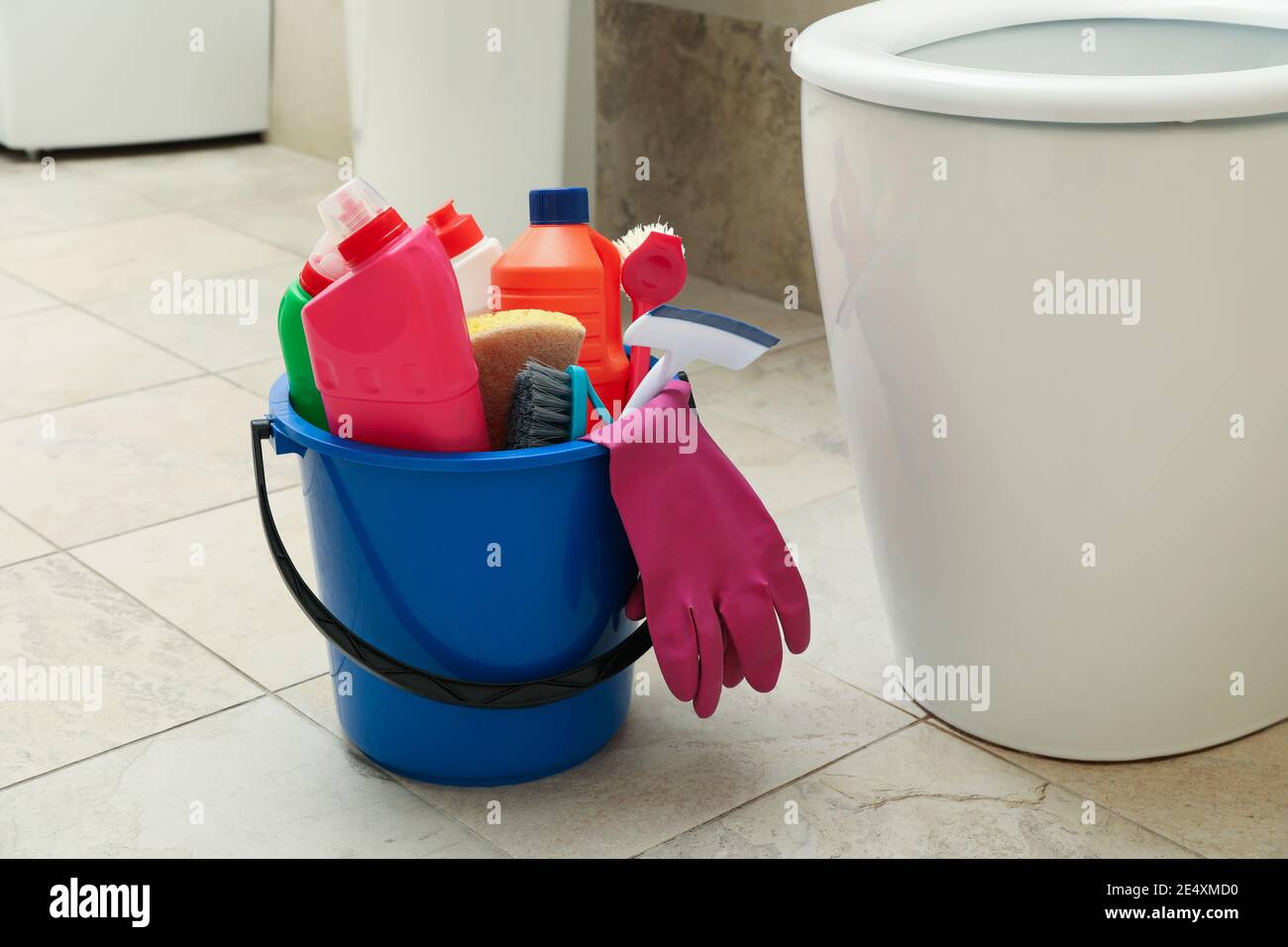 Bucket with cleaning products in modern bathroom Stock Photo - Alamy
