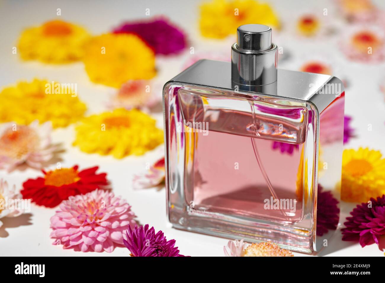 Perfume bottle for women in flower buds Stock Photo - Alamy