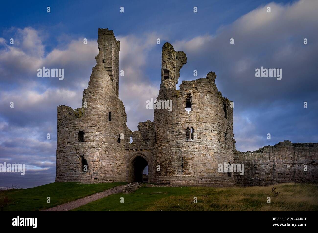 Dunstanburgh castle main gateway and towers Stock Photo - Alamy