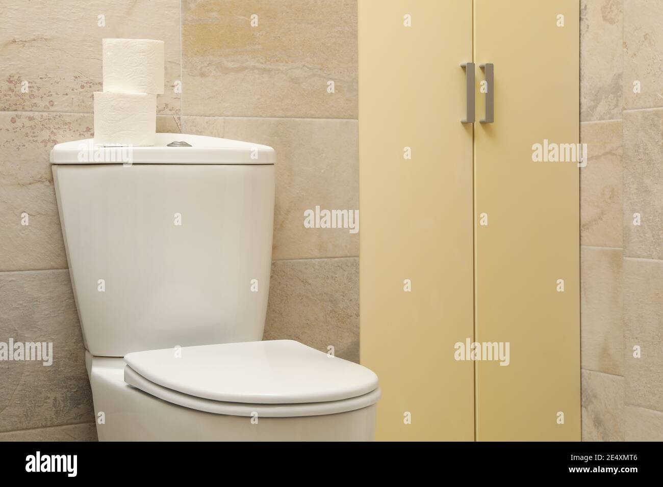 Toilet bowl in modern bathroom in light beige color Stock Photo - Alamy