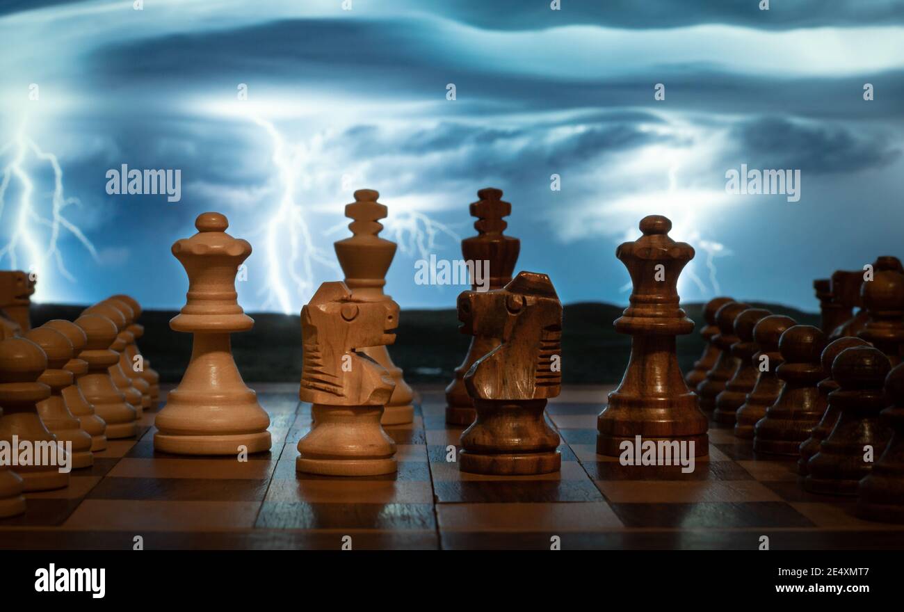 Closeup shot of two chess kings, queens, and horses standing next to ...