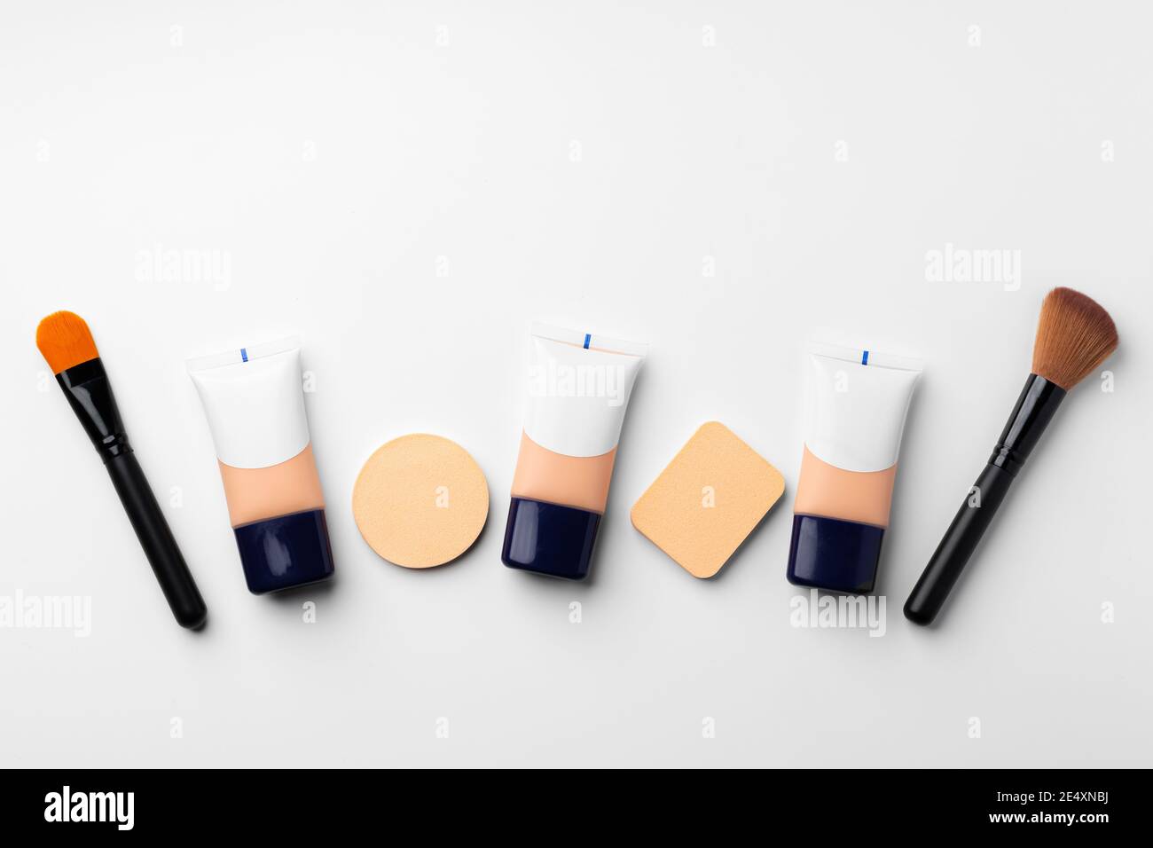 Make up liquid foundation with brush on white background Stock Photo ...