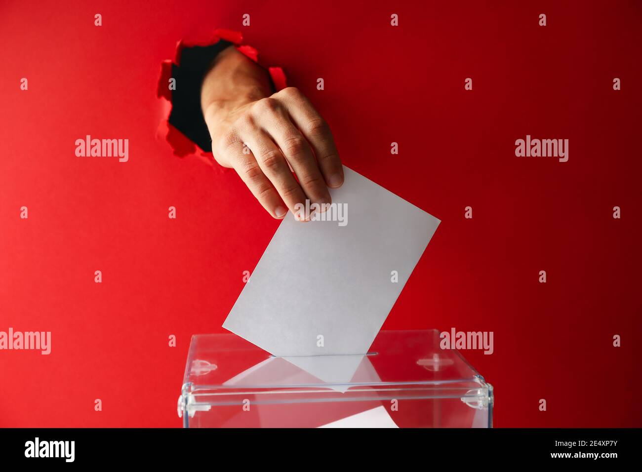 Hand putting paper ballot box hi-res stock photography and images - Alamy