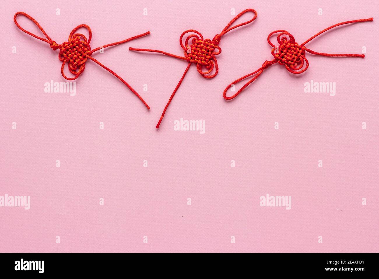 Chinese red knots for good luck, top view Stock Photo - Alamy
