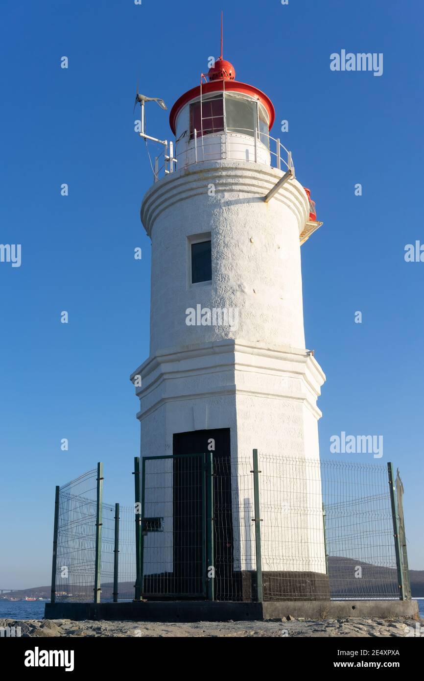Tokarevsky lighthouse against the blue sky. Vladivostok, Russia Stock ...
