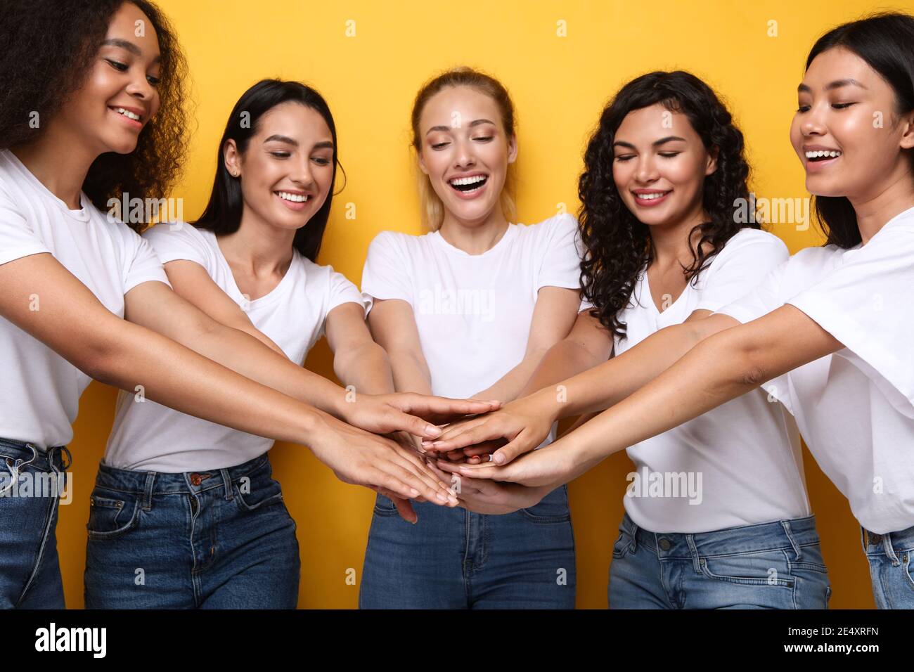 United Multicultural Women Holding Hands Standing Together In Studio ...
