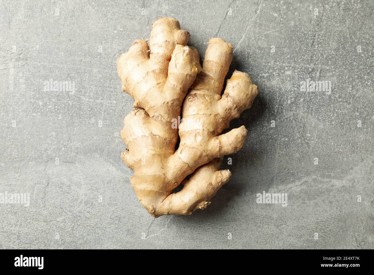 Fresh raw ginger on gray background, space for text Stock Photo - Alamy