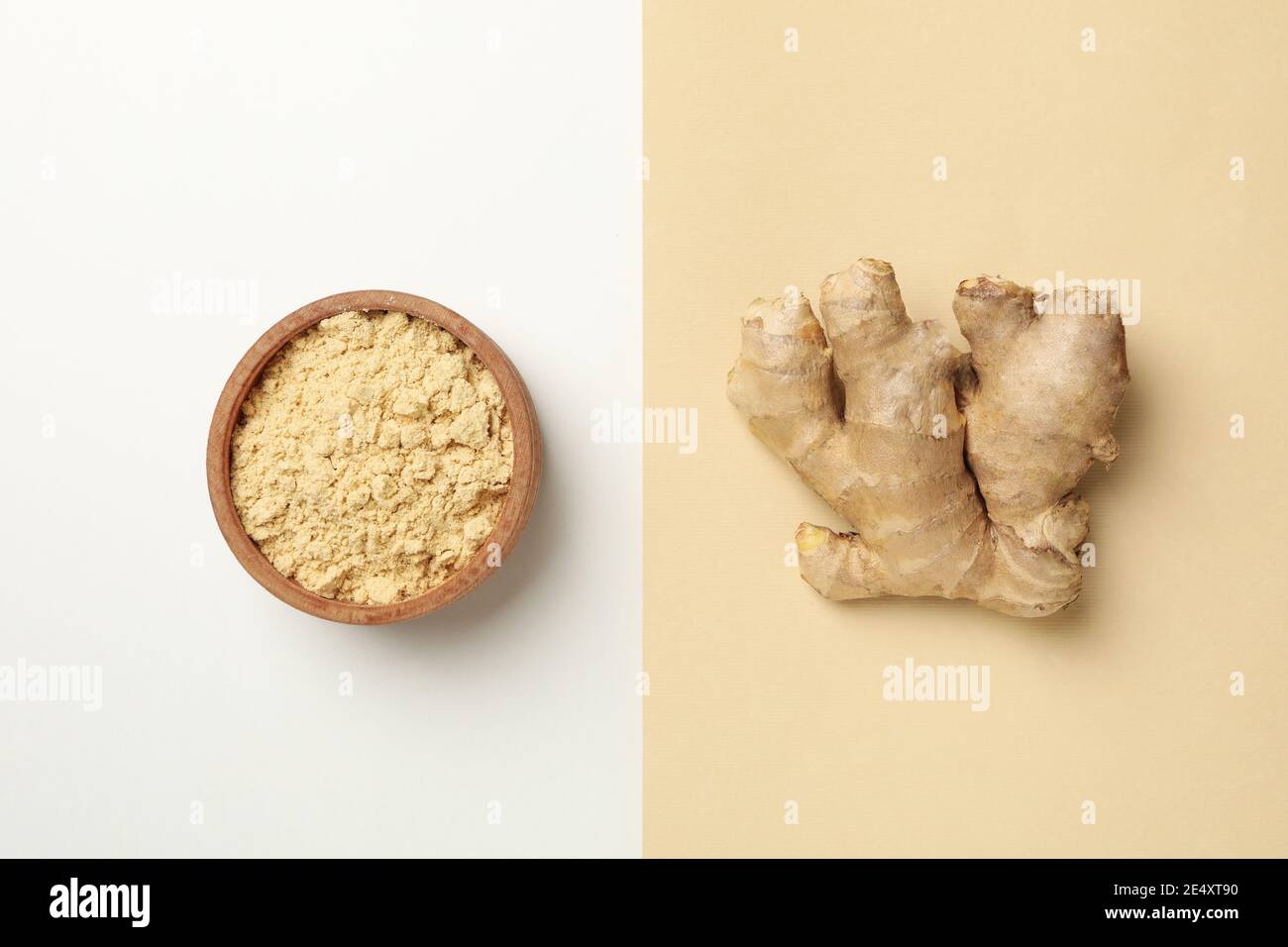Ginger and ginger powder on two tone background Stock Photo - Alamy