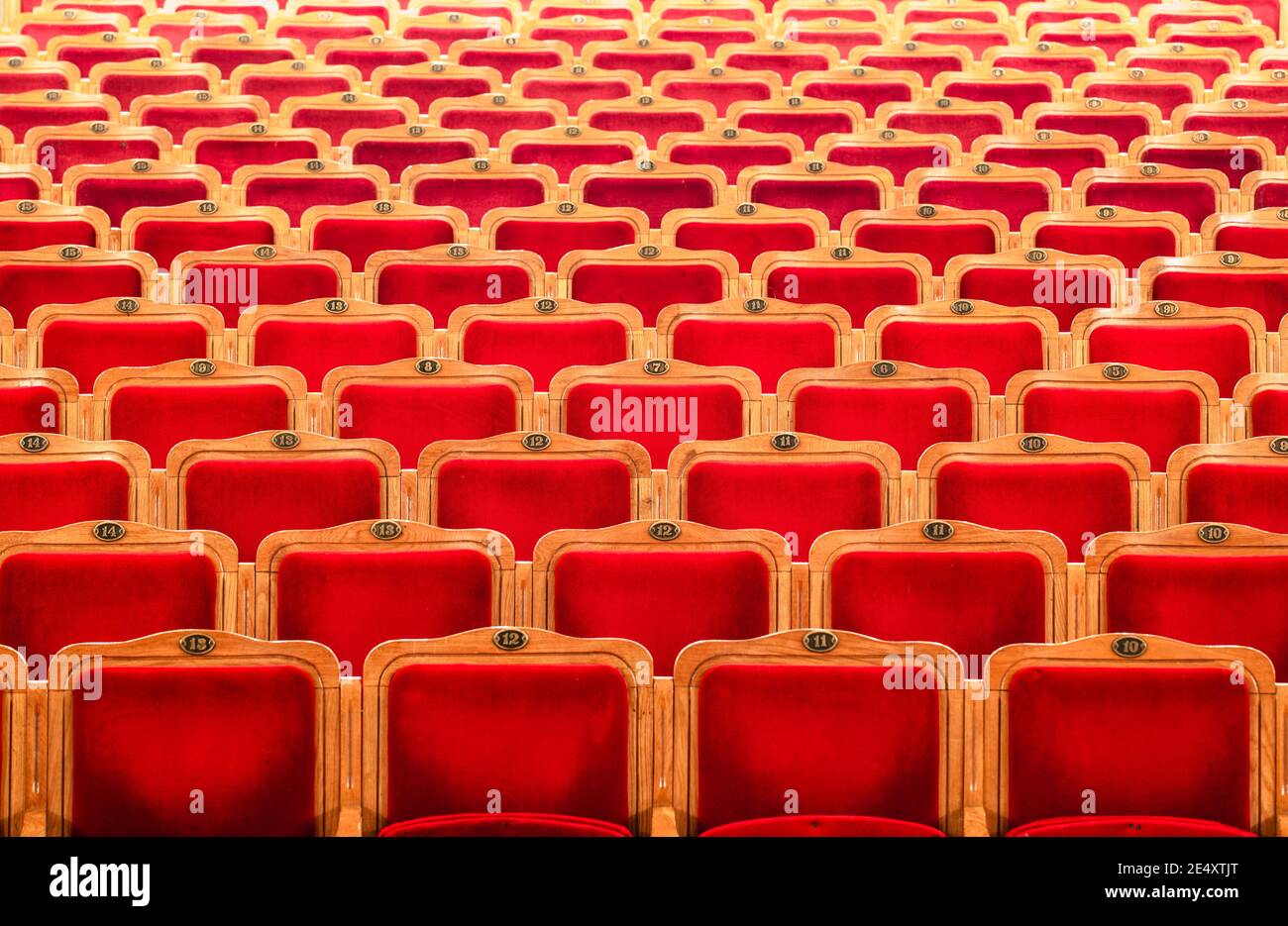 Row of red seats in theatre Stock Photo - Alamy