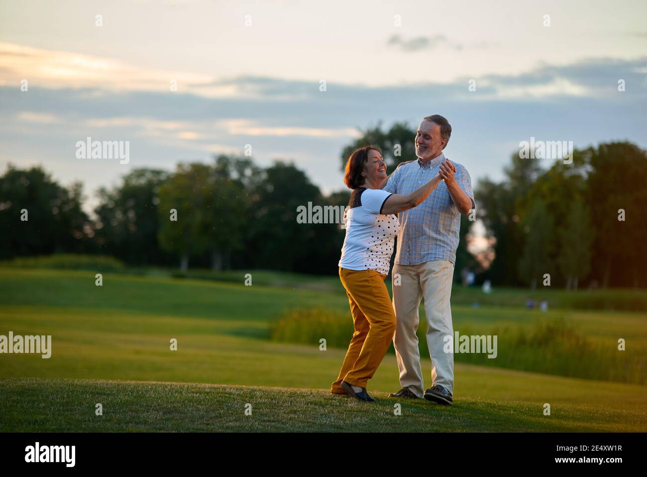 Happy loving couple dancing outdoors Stock Photo - Alamy