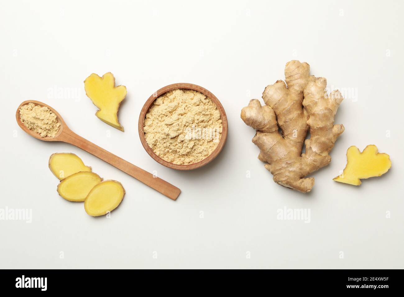 Ginger and bowl with ginger powder on white background Stock Photo - Alamy