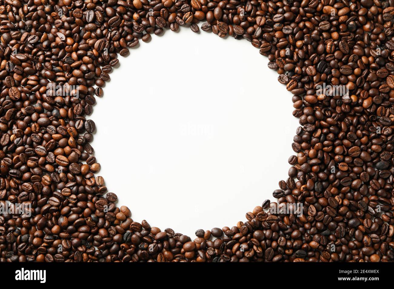 Roasted coffee beans on white background, space for text Stock Photo ...