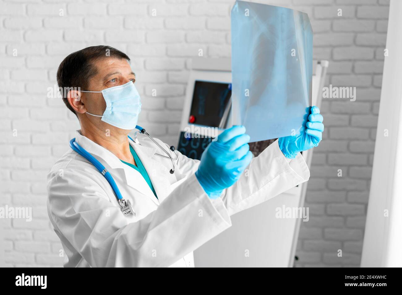 Doctor examining lungs x-ray scan in his office in hospital Stock Photo ...