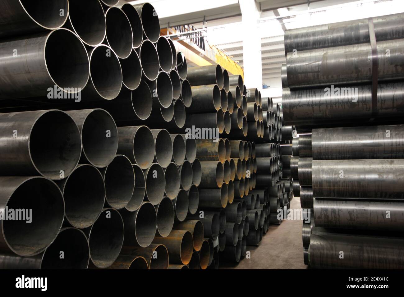 steel metal pipe stack inside factory Stock Photo - Alamy