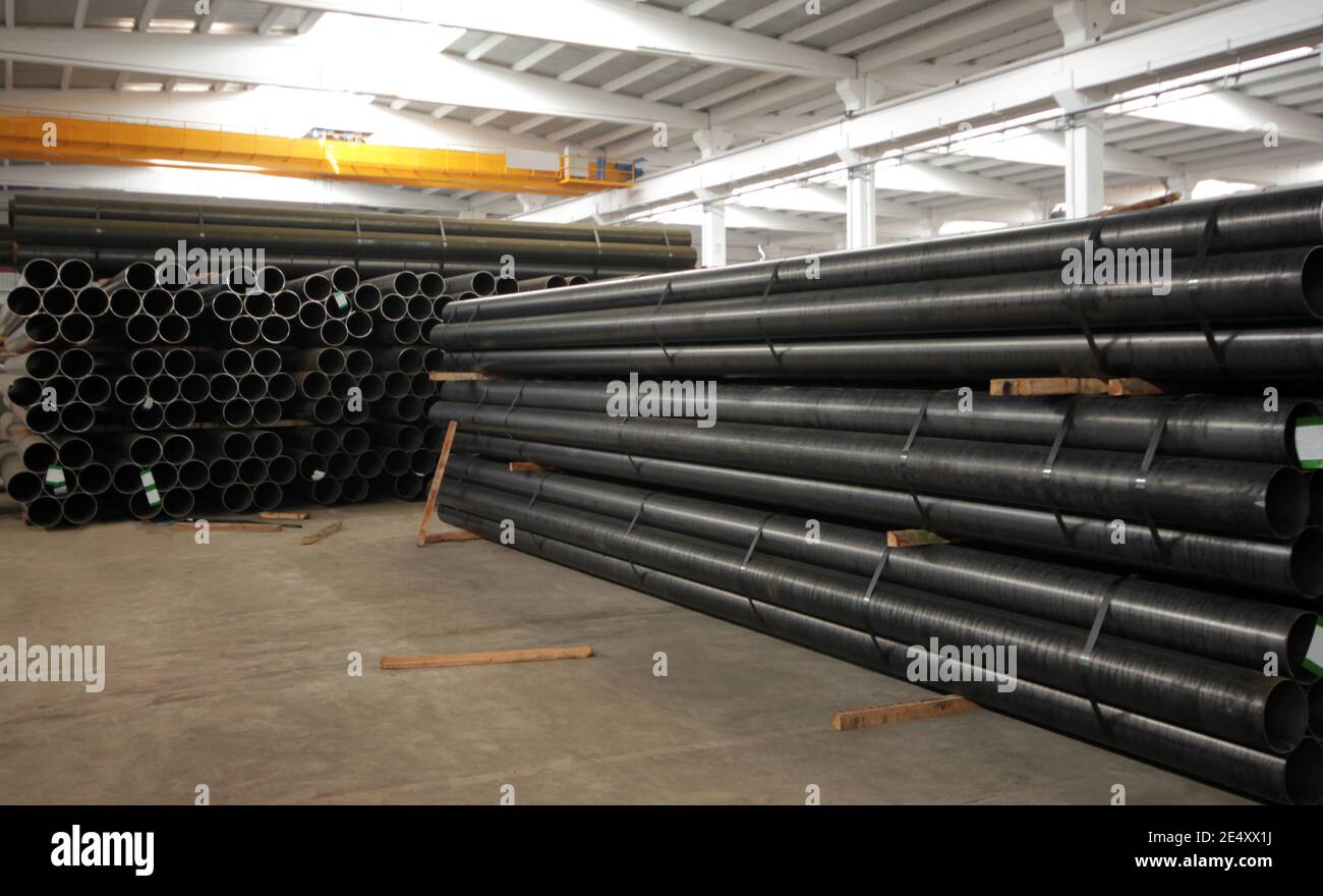 steel metal pipe stack inside factory Stock Photo - Alamy
