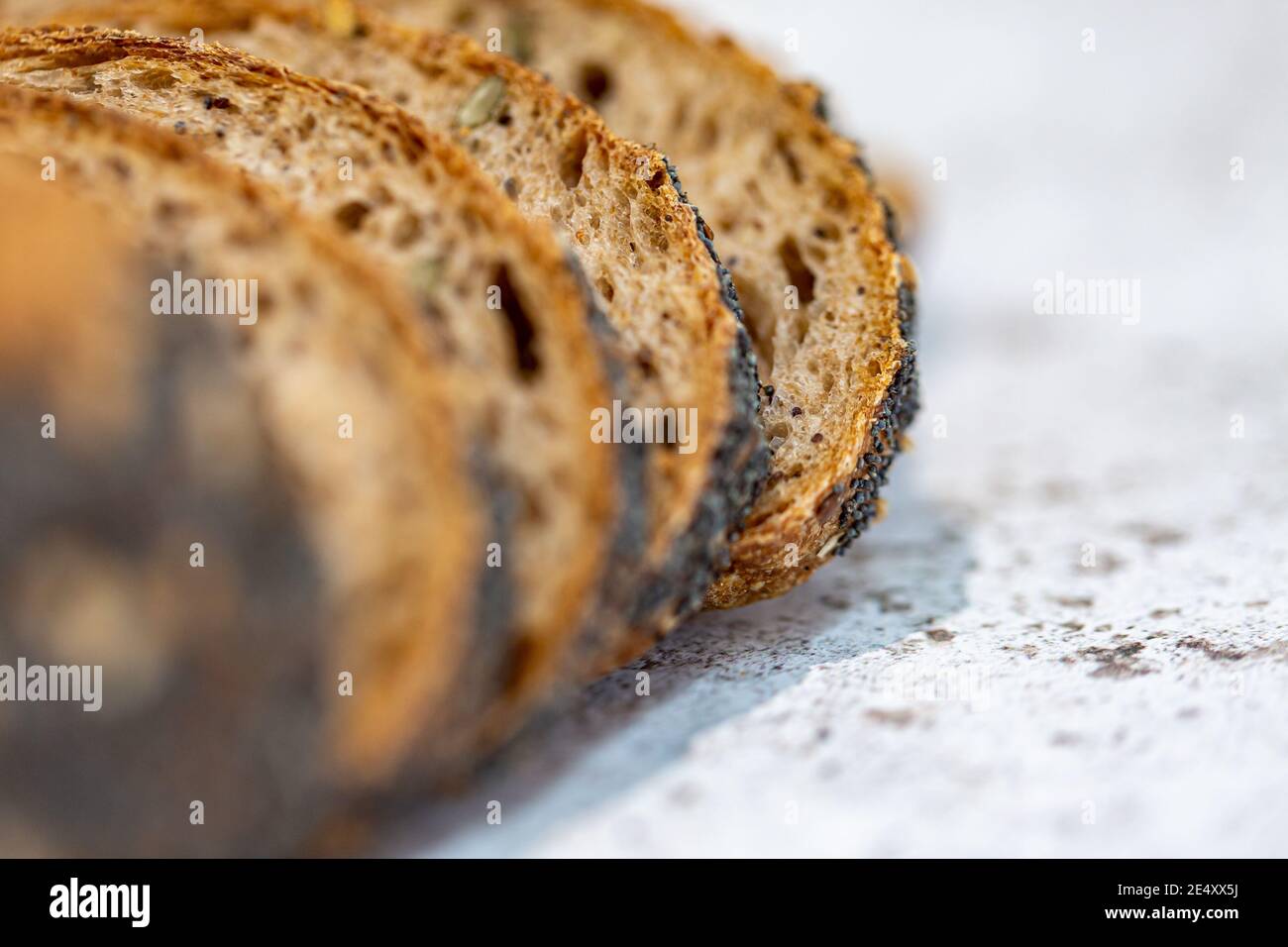Sliced seeded sourdough bread with a shallow depth of field Stock Photo ...