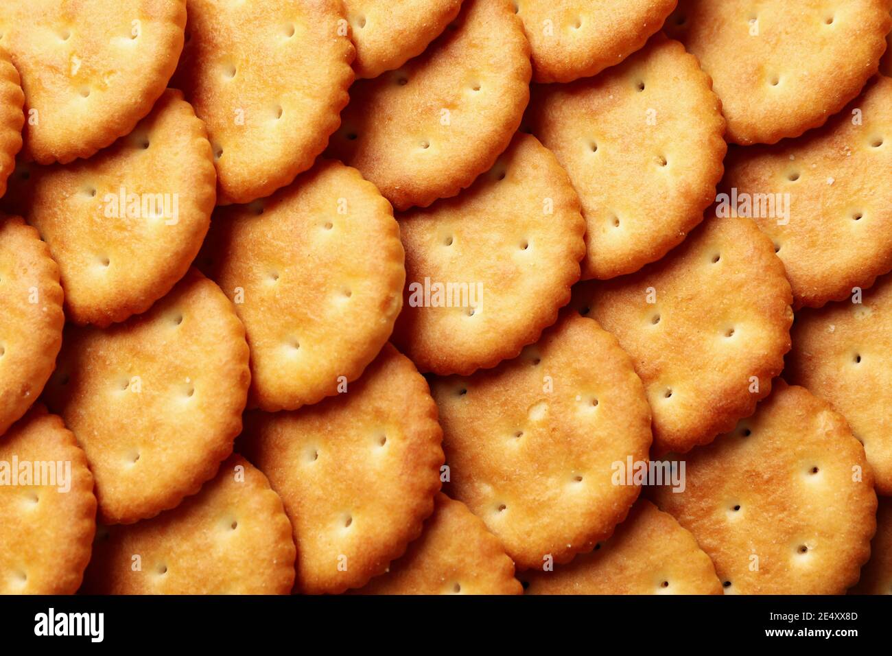 Tasty cracker biscuits on whole background, close up Stock Photo - Alamy