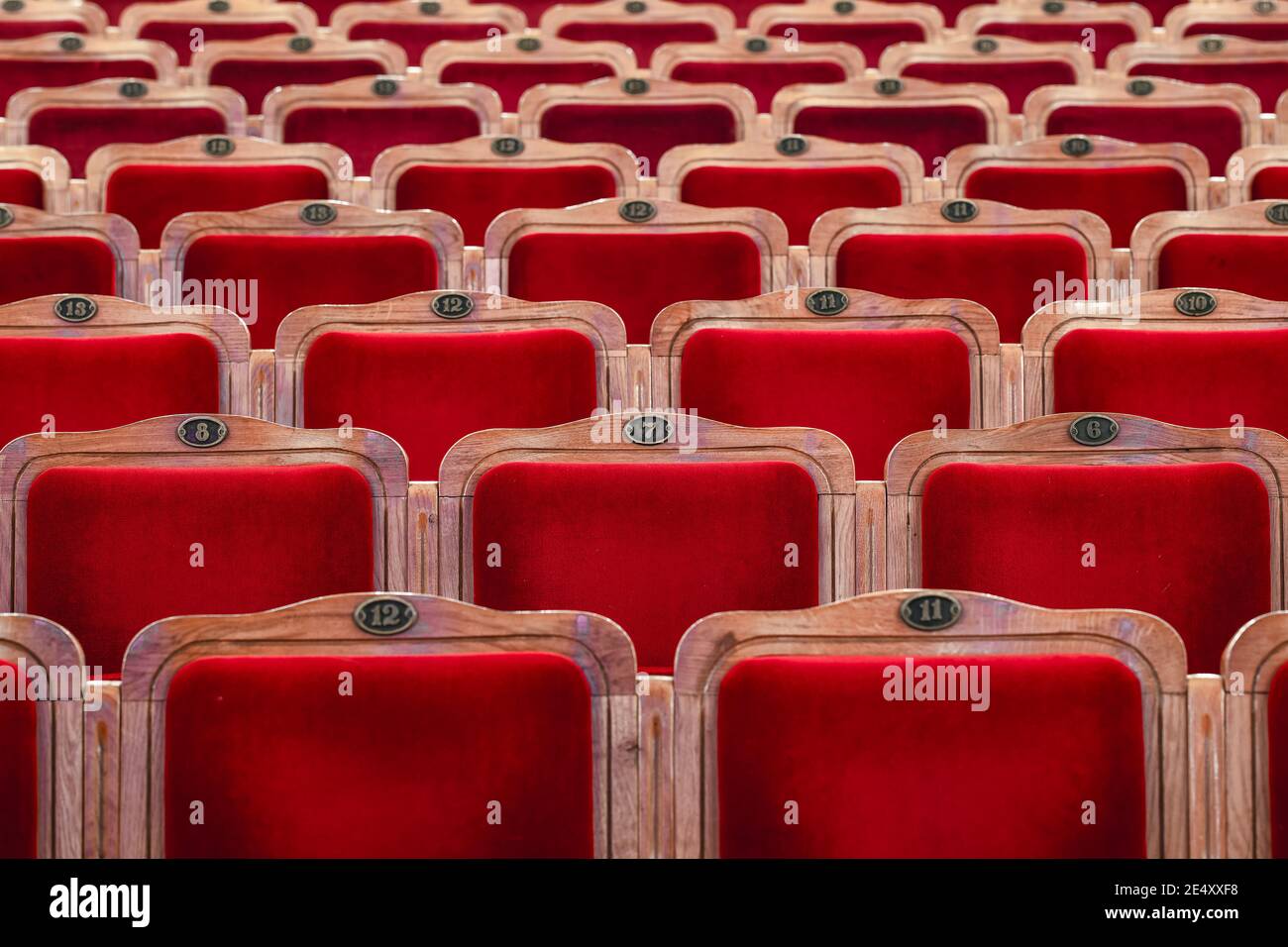 Row of red seats in theatre Stock Photo - Alamy