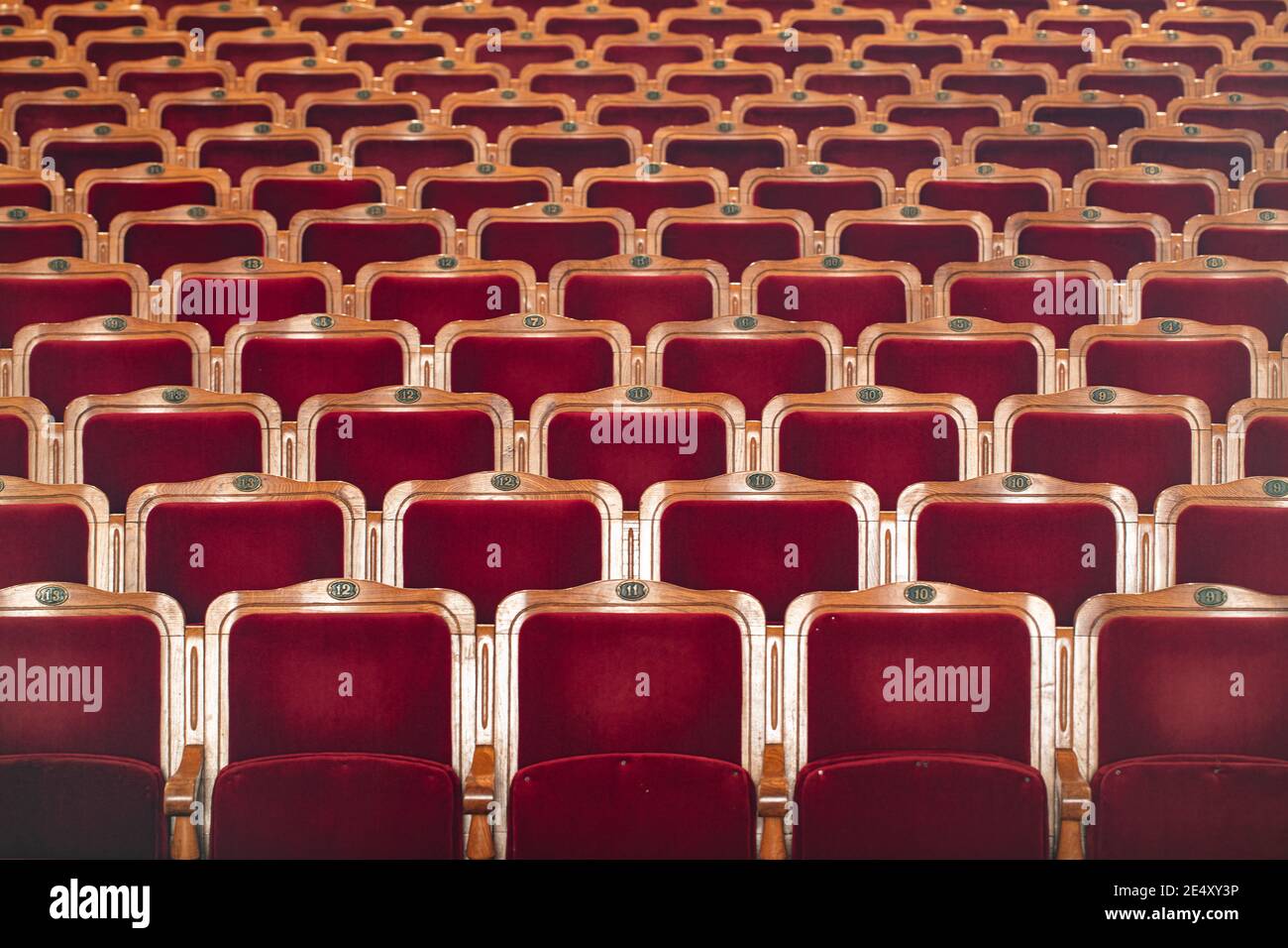Row of red seats in theatre Stock Photo - Alamy