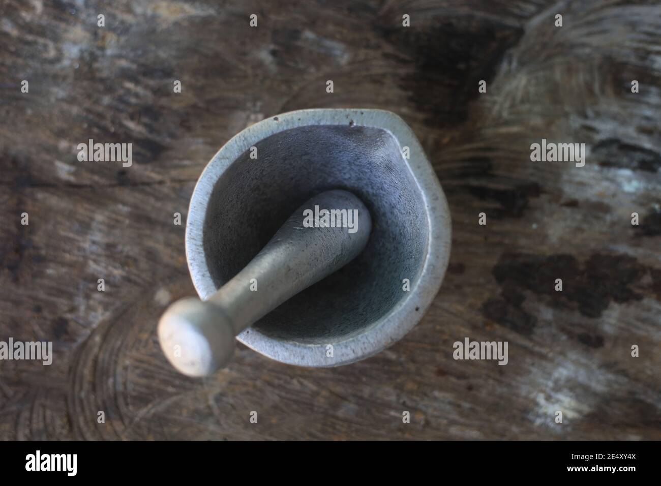 Closeup top view of a metal mortar Stock Photo - Alamy