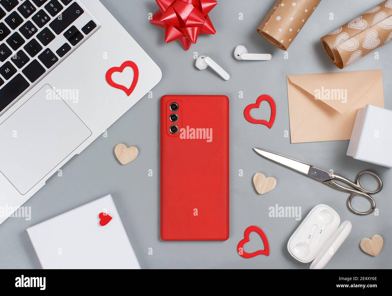 Red Mobile phone, Hearts, laptop, earphones, scissors, gift boxes and ...