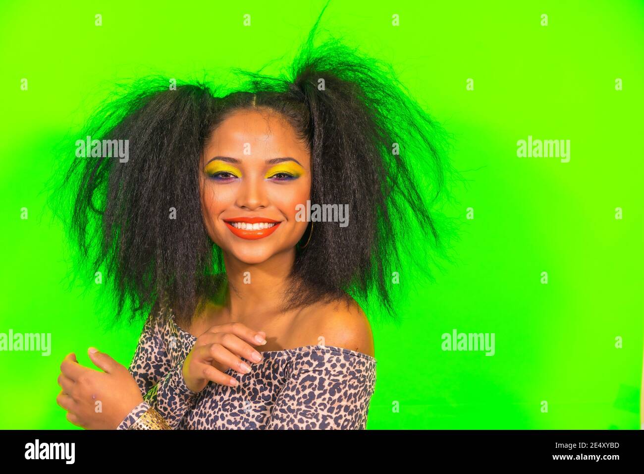 Positive young hipster girl with bright makeup and two tails hairstyle ...