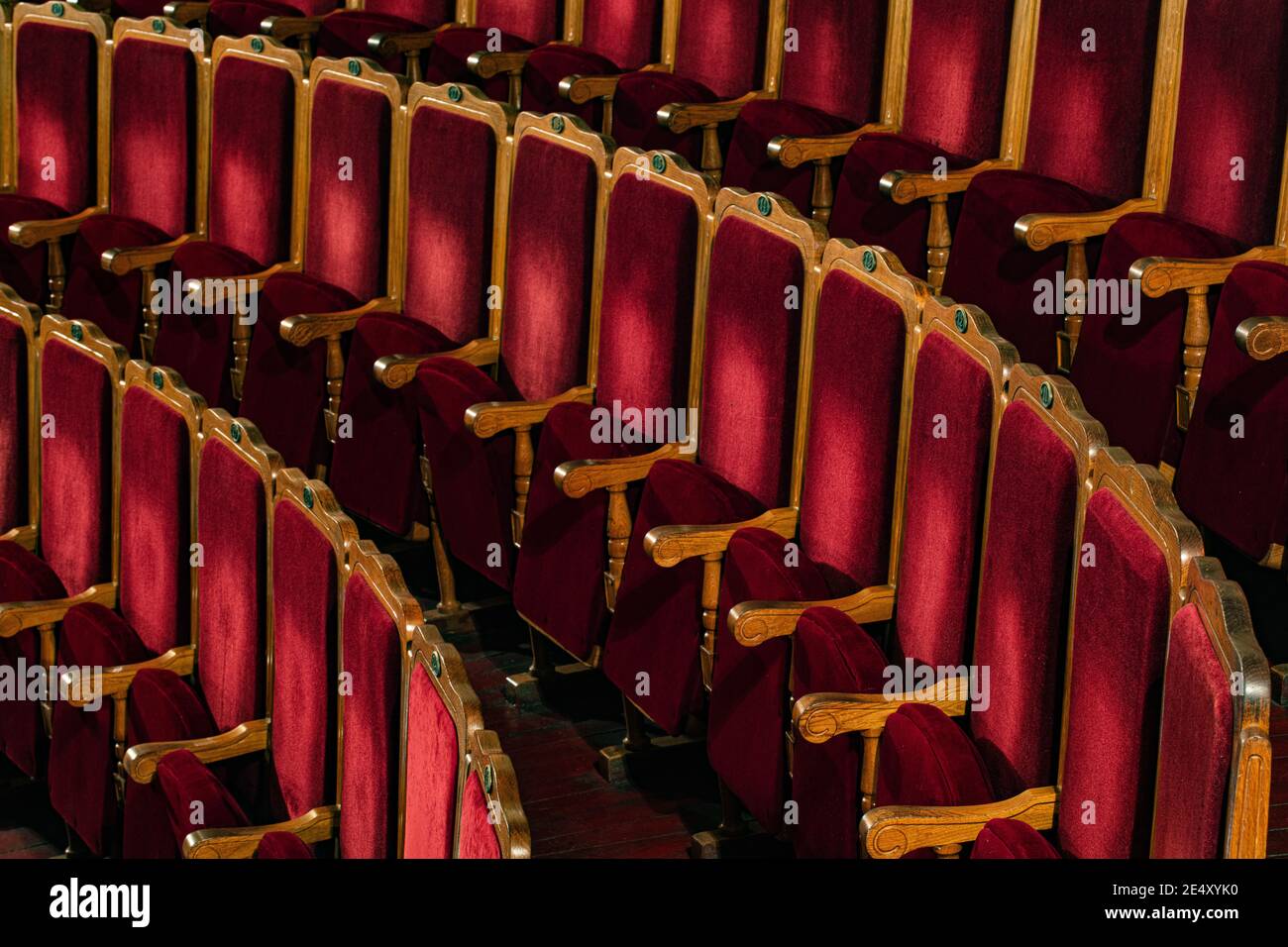 Row of red seats in theatre Stock Photo - Alamy