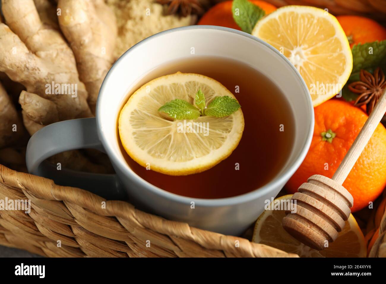 Basket with ginger, orange, cinnamon, lemon and tea Stock Photo - Alamy