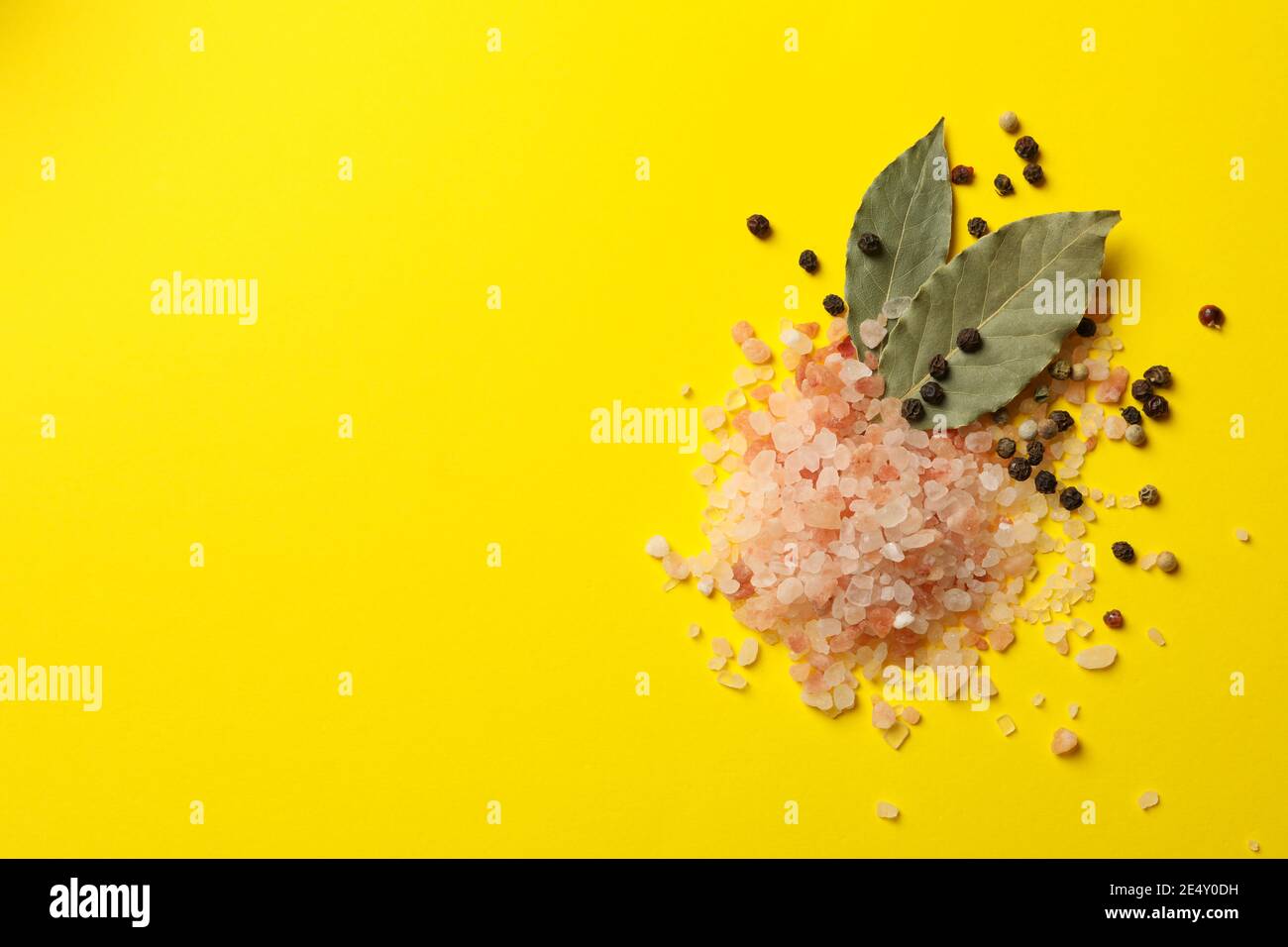 Pink himalayan salt and spices on yellow background Stock Photo - Alamy