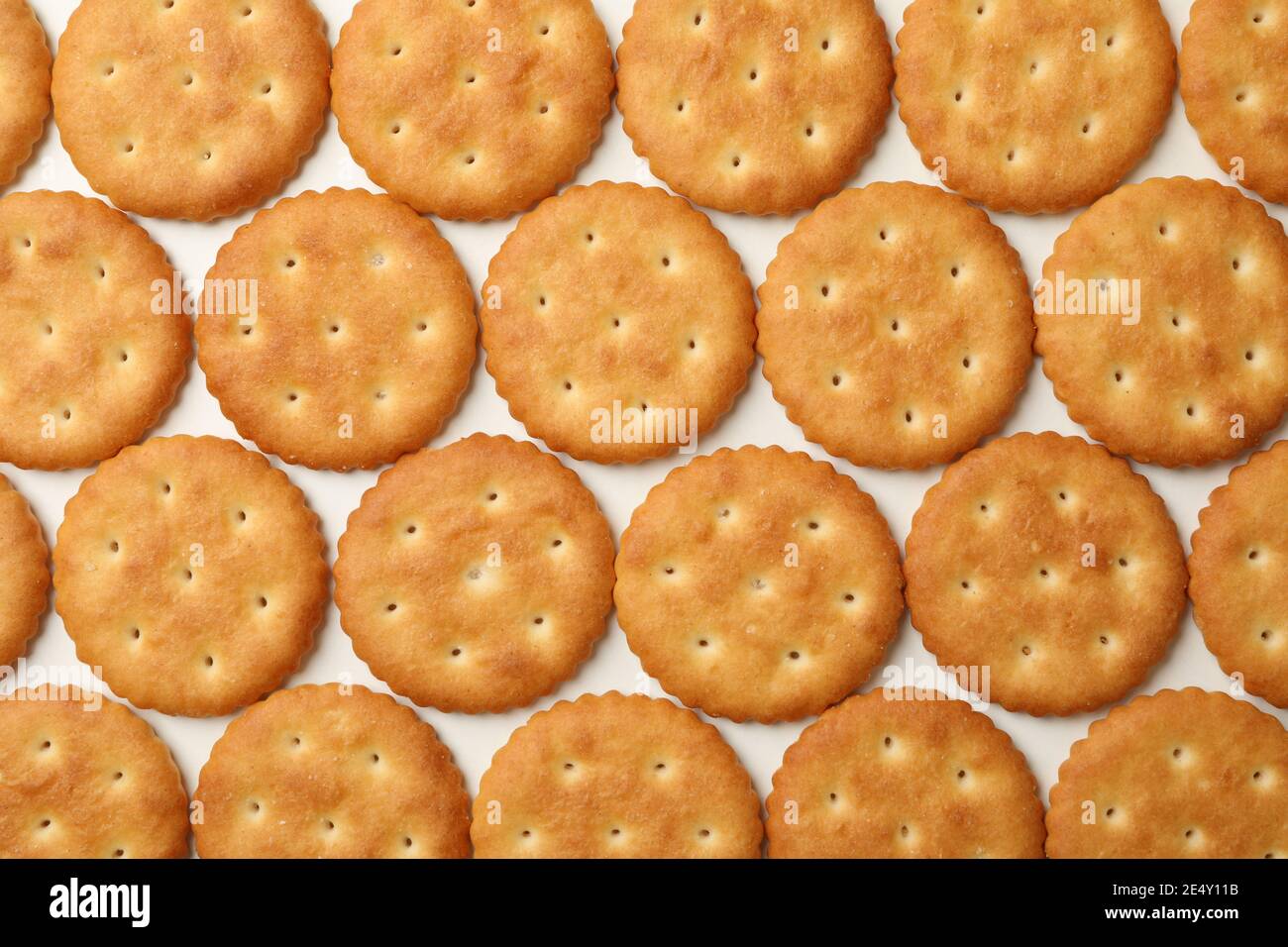 Flat lay with cracker biscuits on white background Stock Photo - Alamy