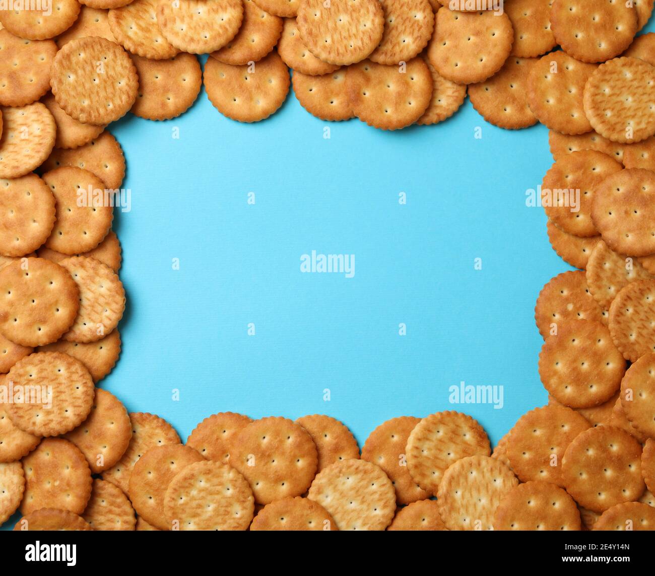Tasty cracker biscuits on blue background, space for text Stock Photo ...