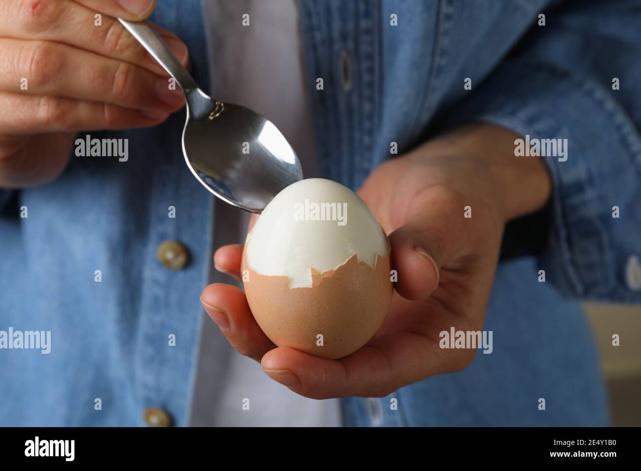 Woman eating boiled egg hi-res stock photography and images - Alamy