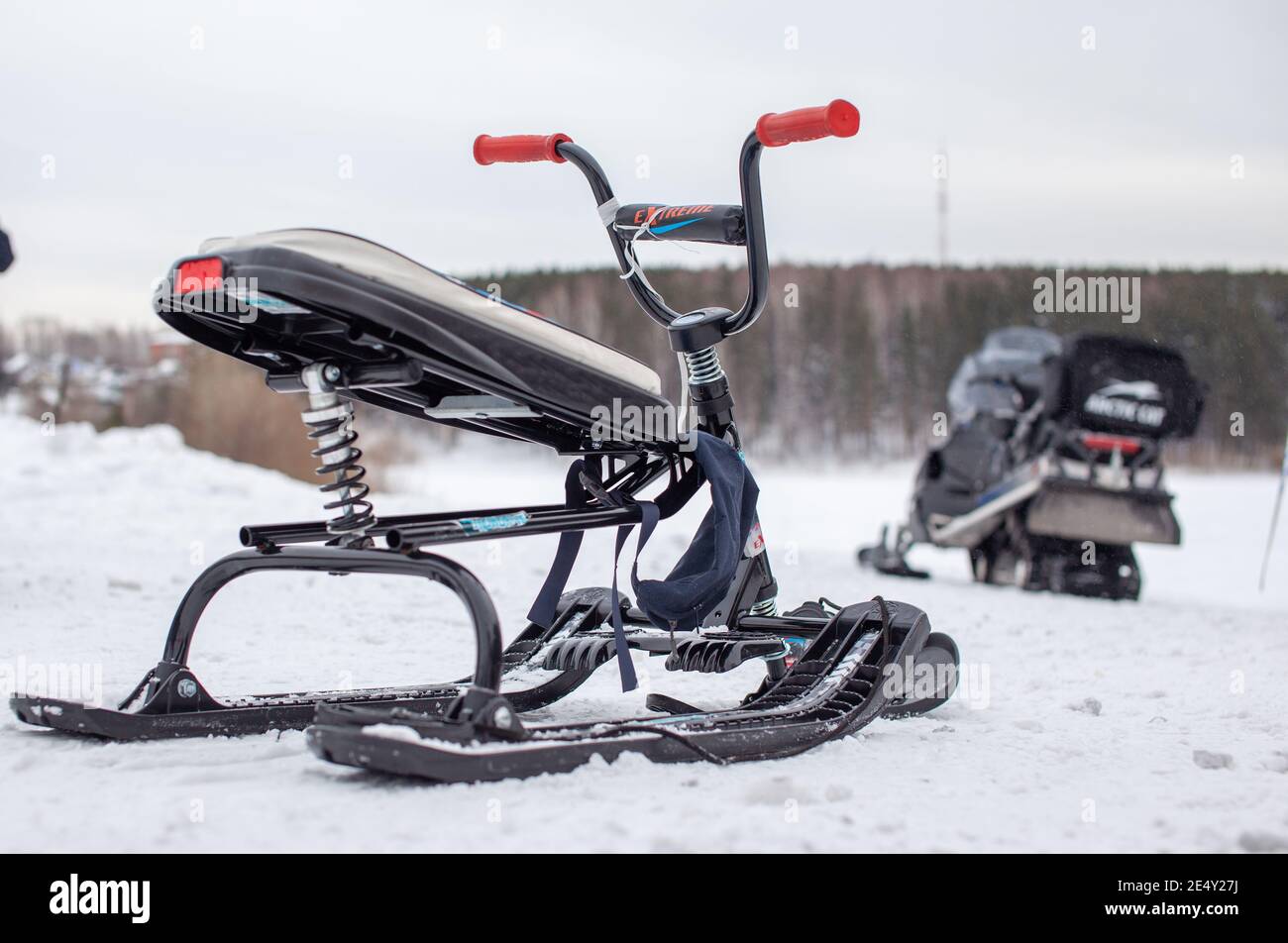 A children's snowmobile is ready for children to ride in the snow Stock ...
