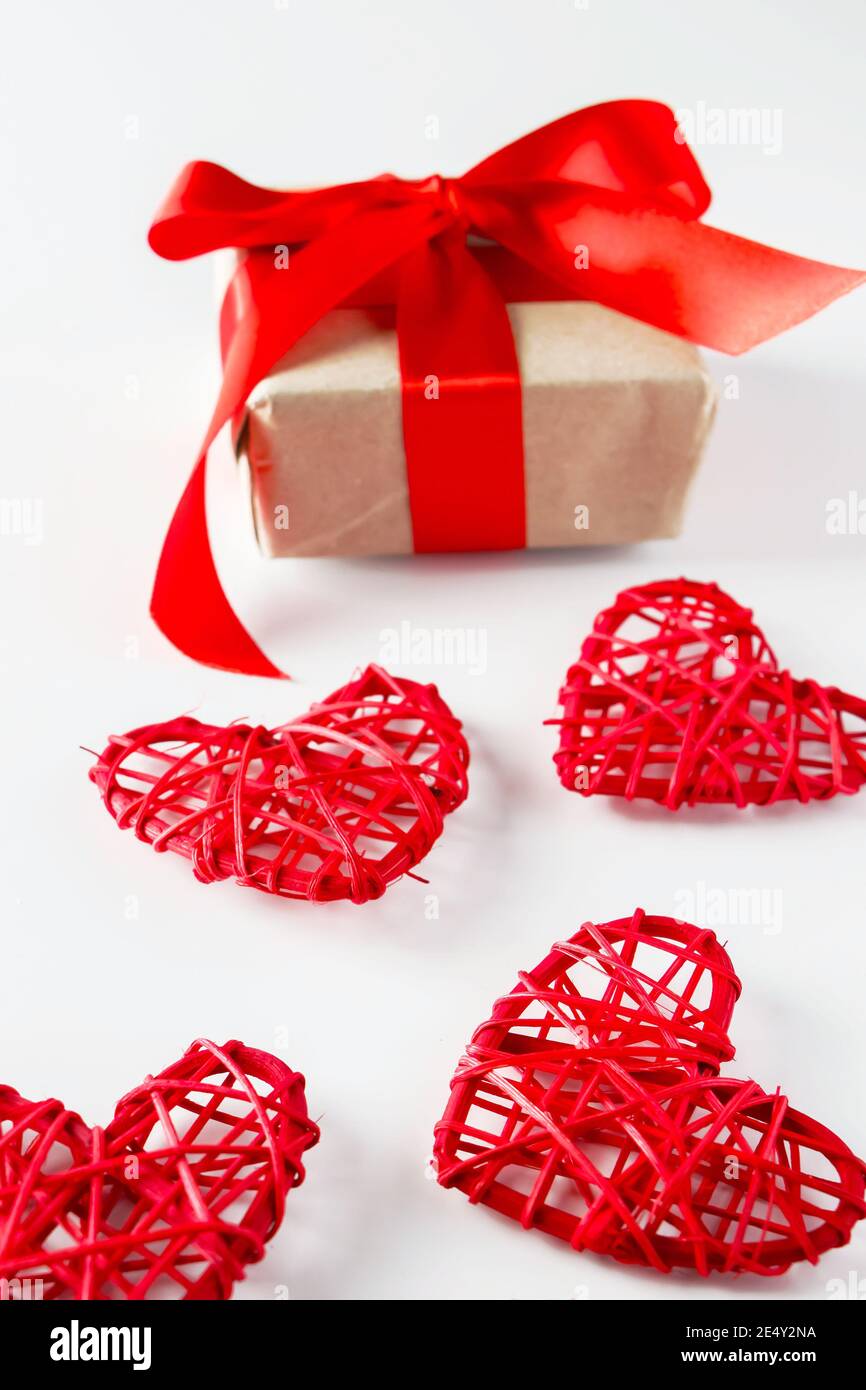 Valentine's day gift and red hearts on white background Stock Photo - Alamy