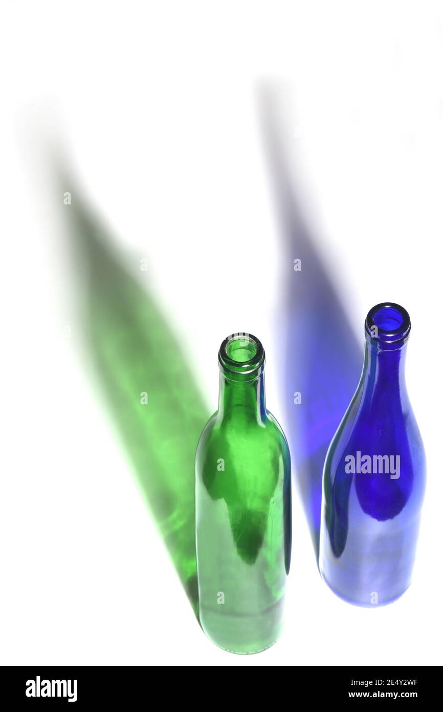 two bottles with its shadow with white background Stock Photo - Alamy