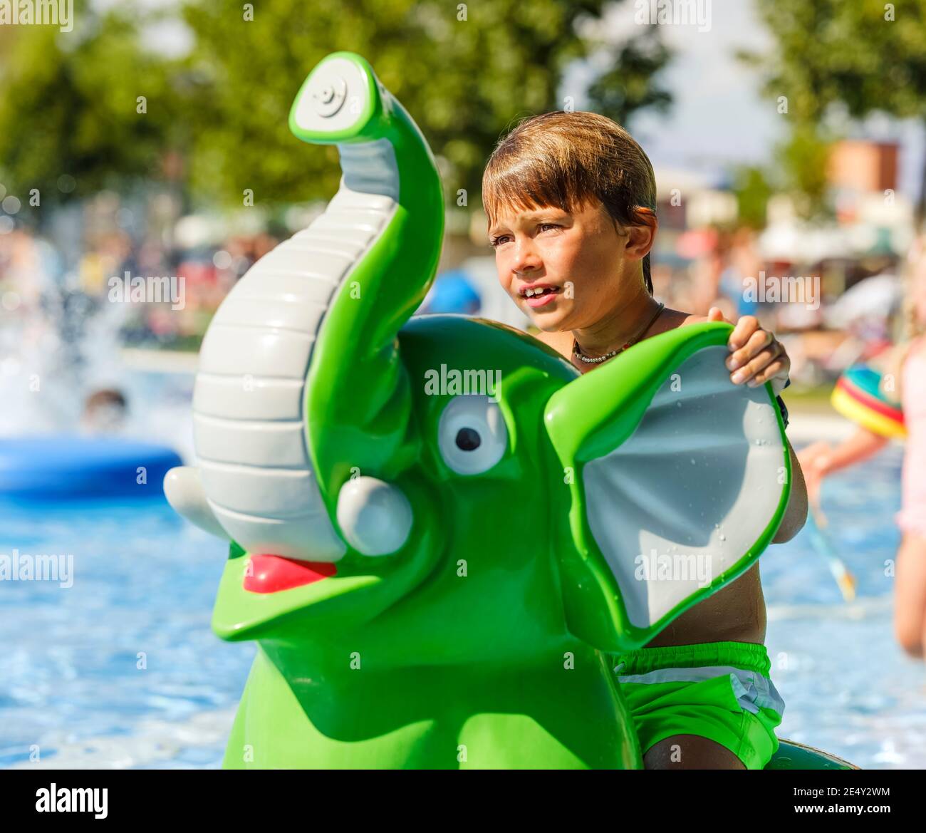 Child playing on water slide hi-res stock photography and images - Alamy