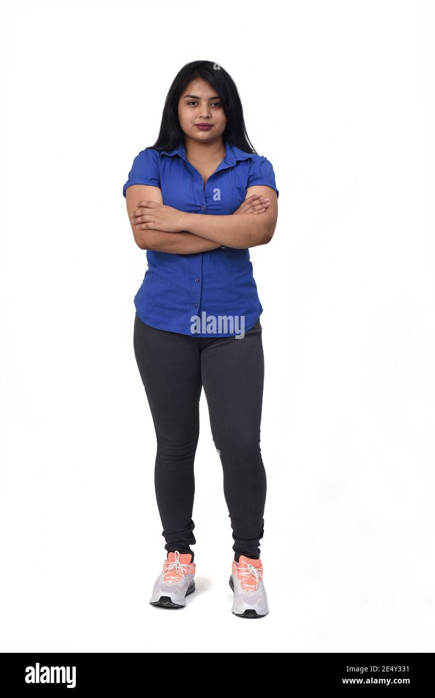 full portrait of a latin woman casual clothes arms crossed on white ...