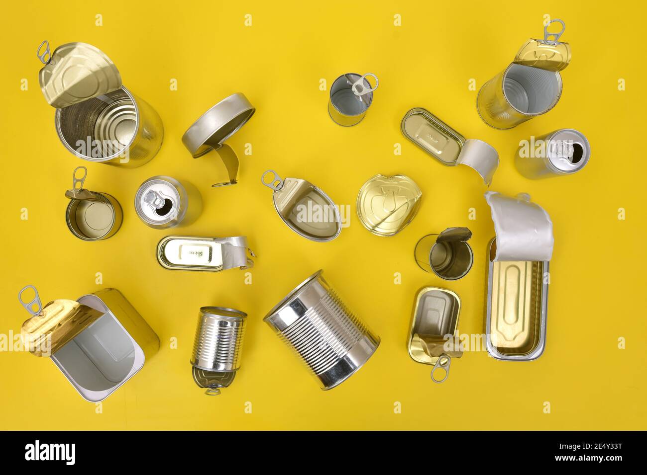 top view of a set of cans on yellow background Stock Photo - Alamy