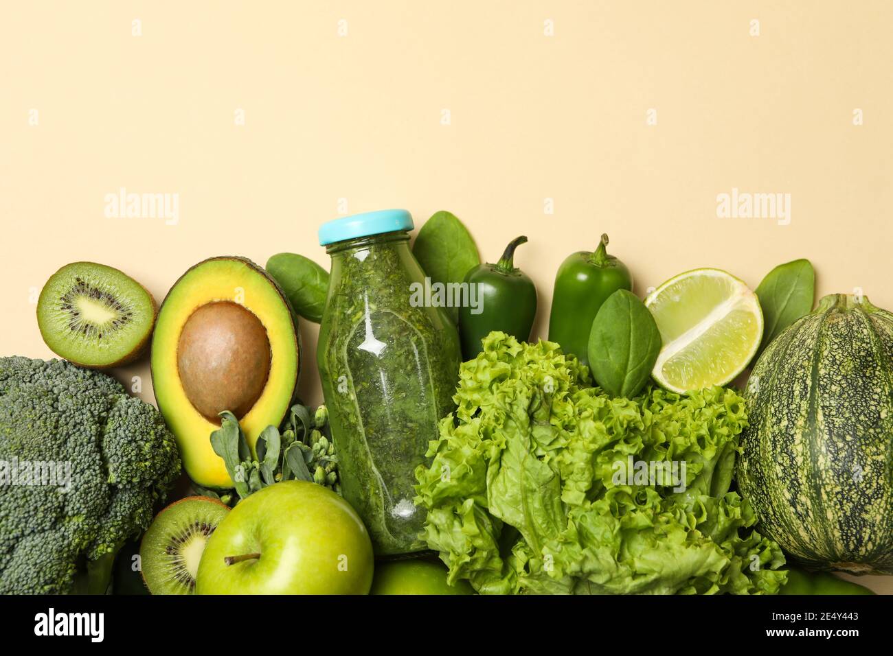Vegetables, fruits and smoothie on beige background Stock Photo - Alamy