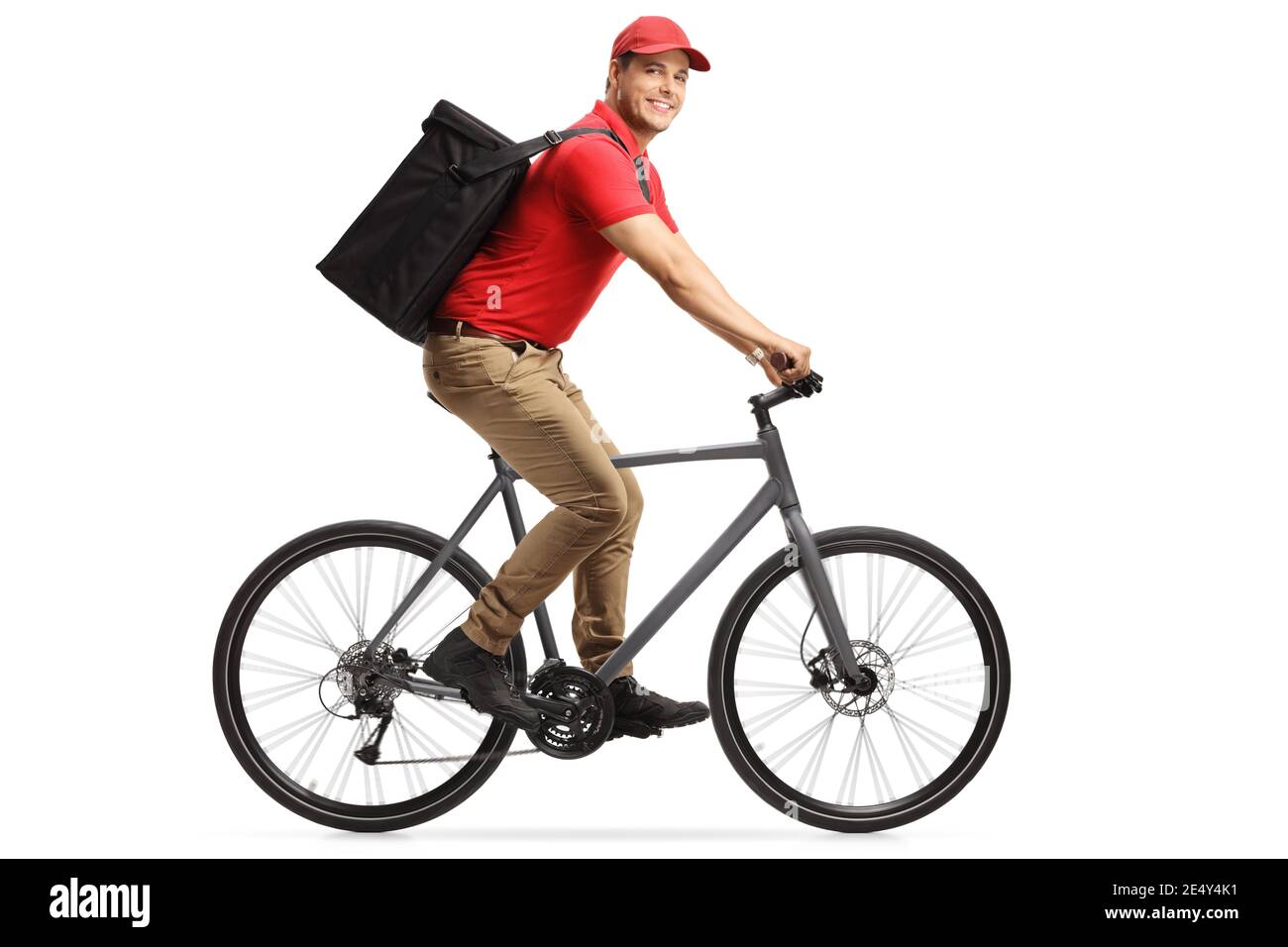 Food delivery man with a bag on a bicycle isolated on white background ...