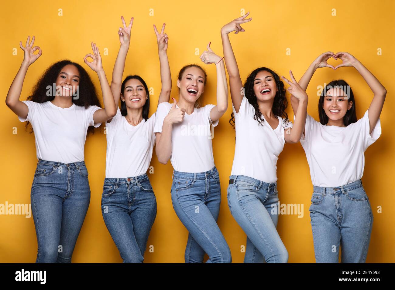 Ladies Gesturing Different Signs And Symbols Raising Hands, Yellow ...