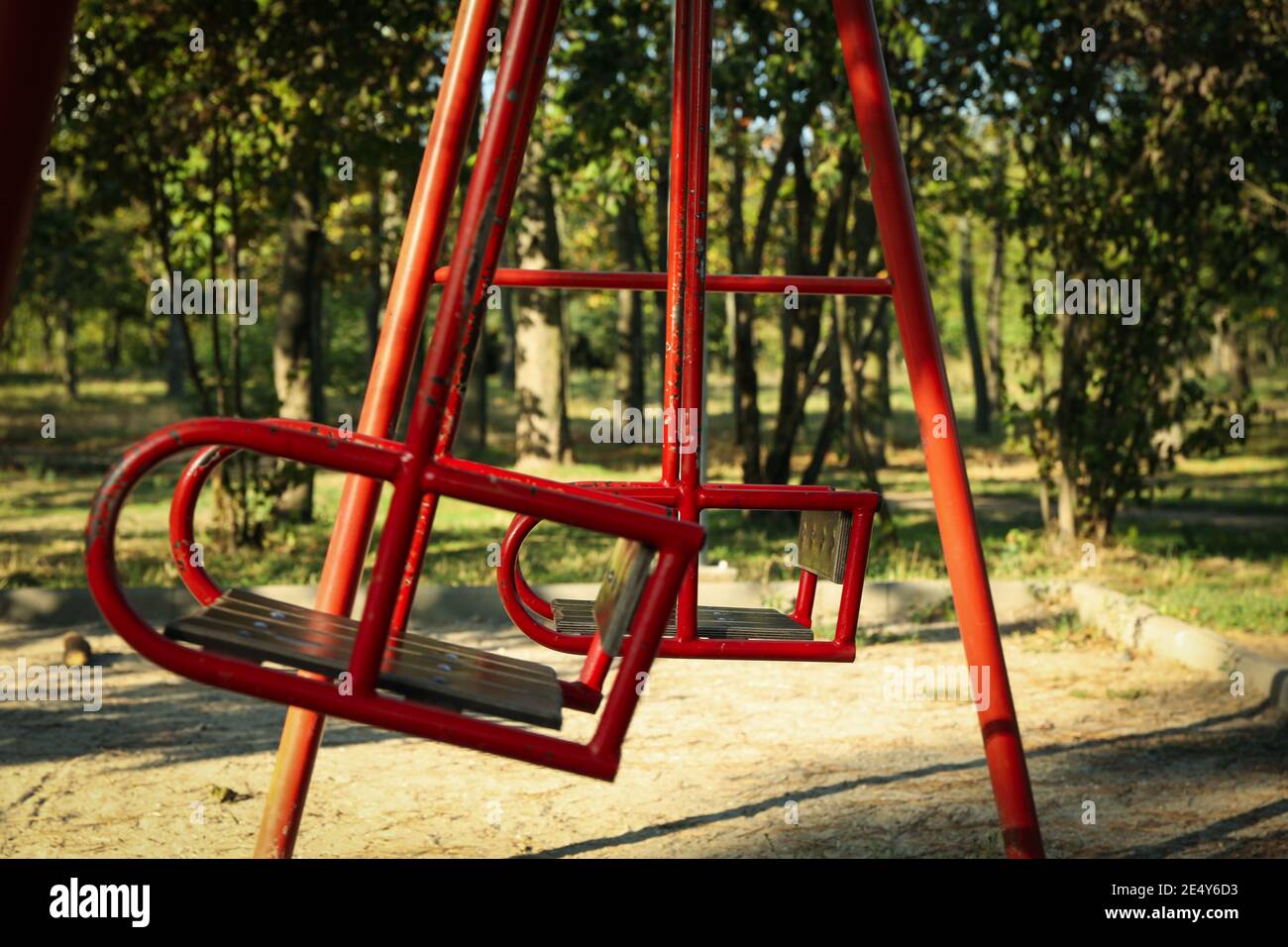 Red swings hi-res stock photography and images - Alamy