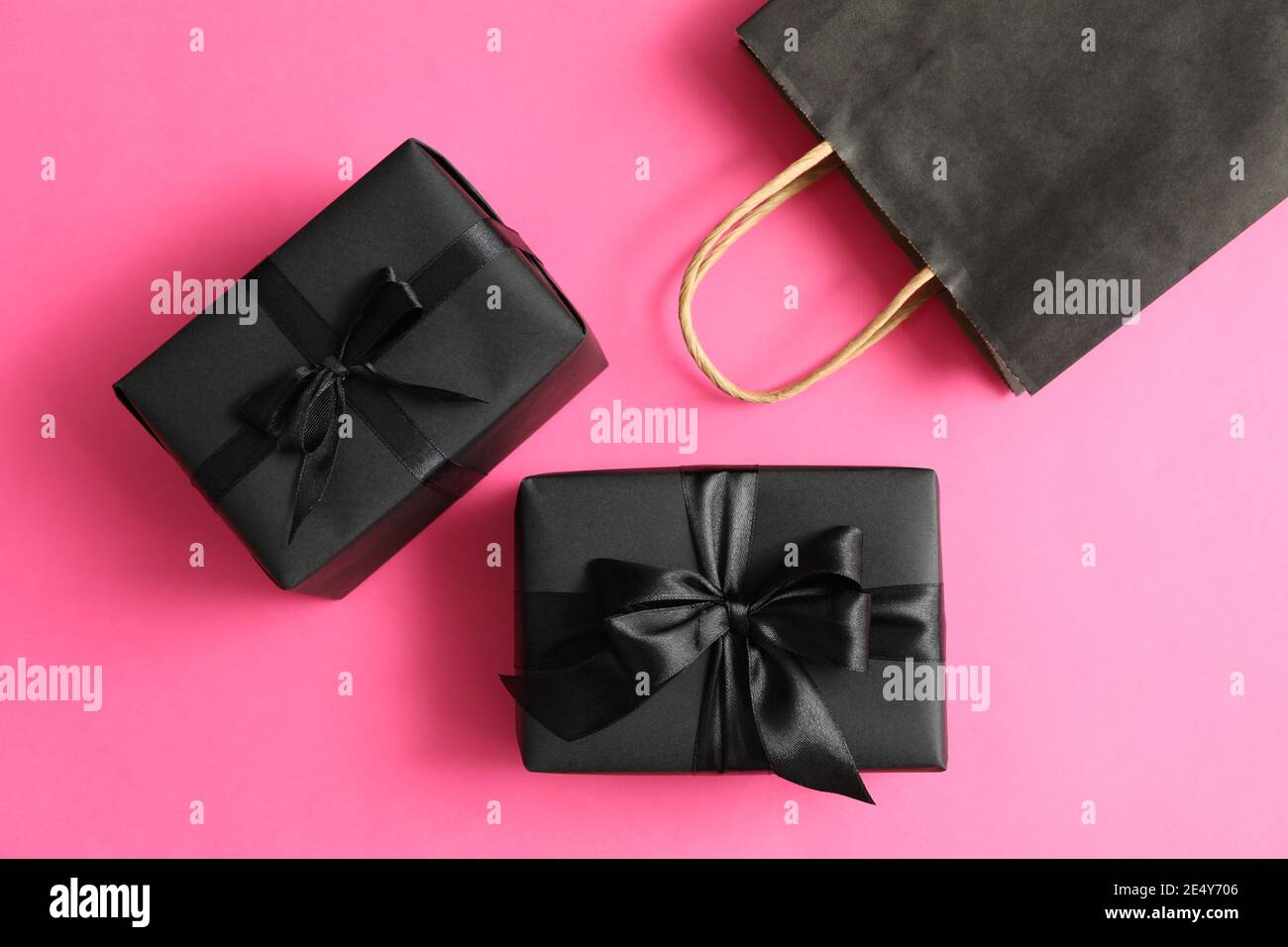 Paper bag and gift boxes on pink background Stock Photo - Alamy