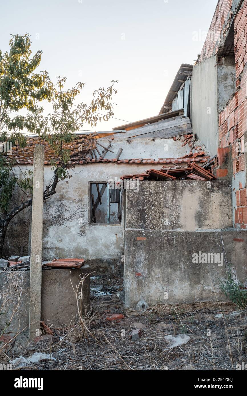 lone brick house abandoned and destroied by the weather with broken ...