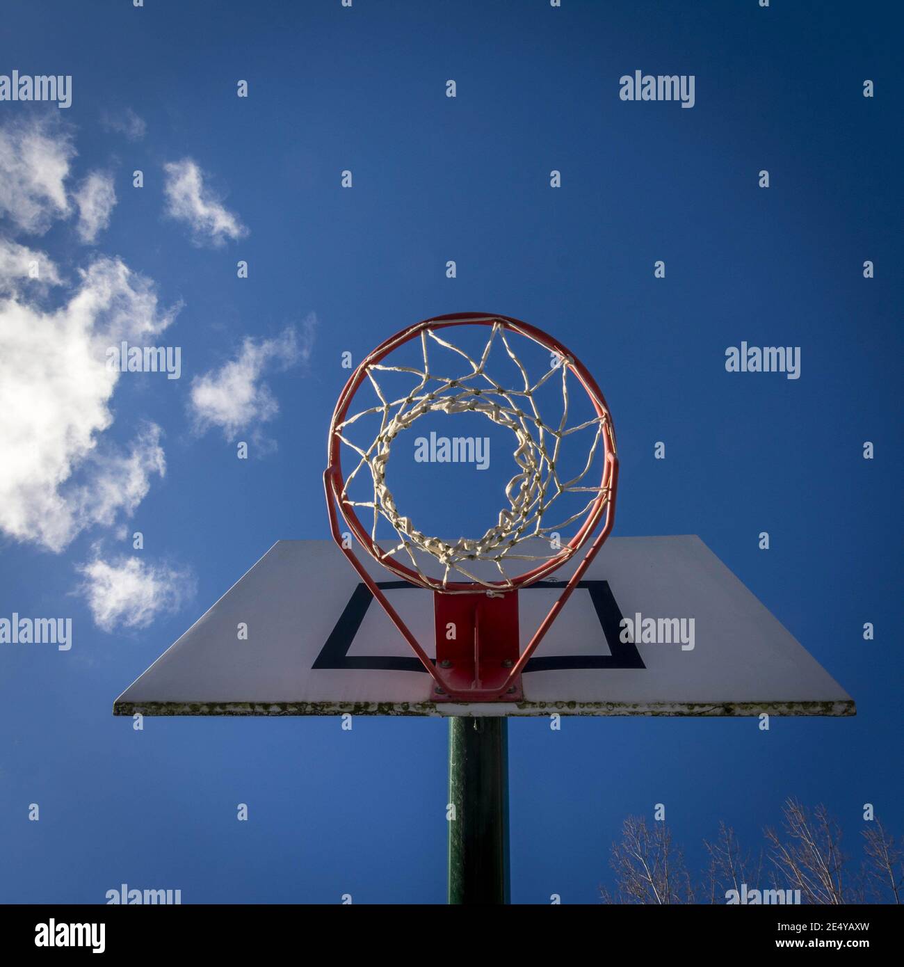 Vertical shot of a basketball hoop and the cloudy sky Stock Photo - Alamy