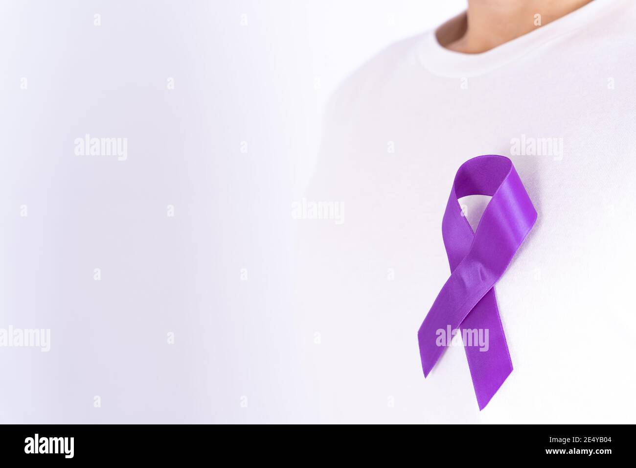 World cancer day, purple ribbon on chest isolated grey background ...