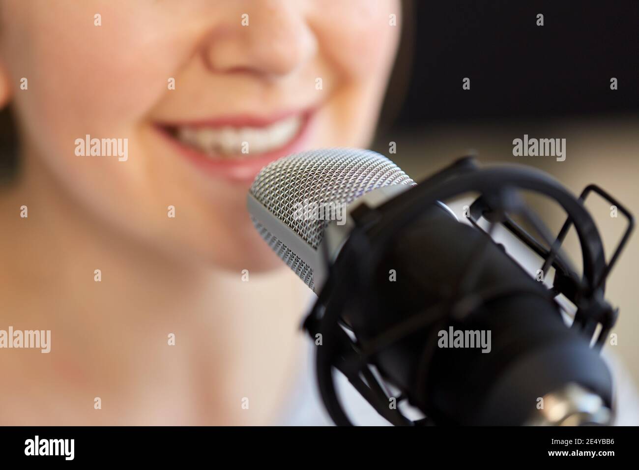 close up of woman talking to microphone Stock Photo - Alamy