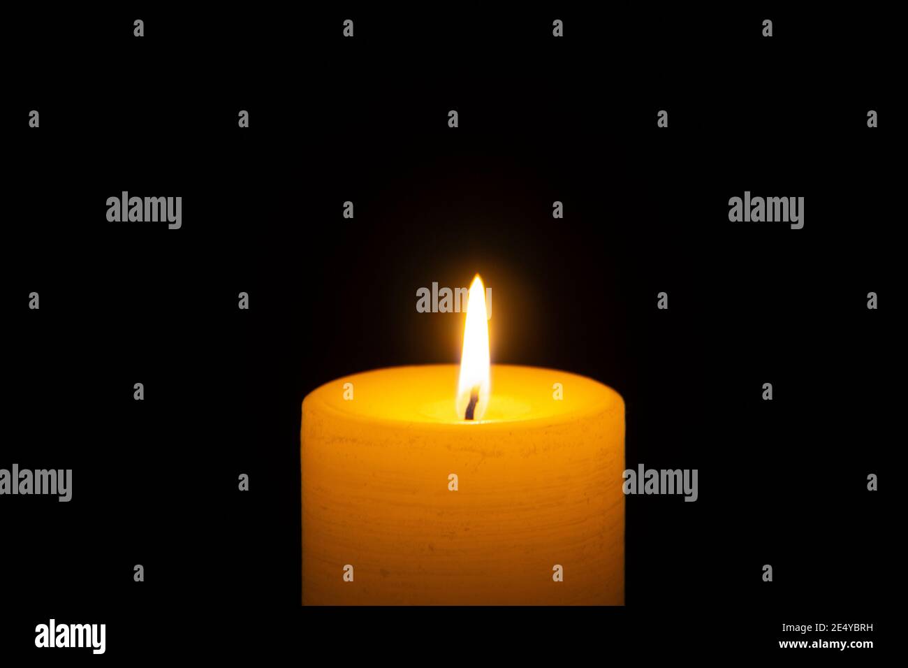 Glowing lit candle Stock Photo - Alamy